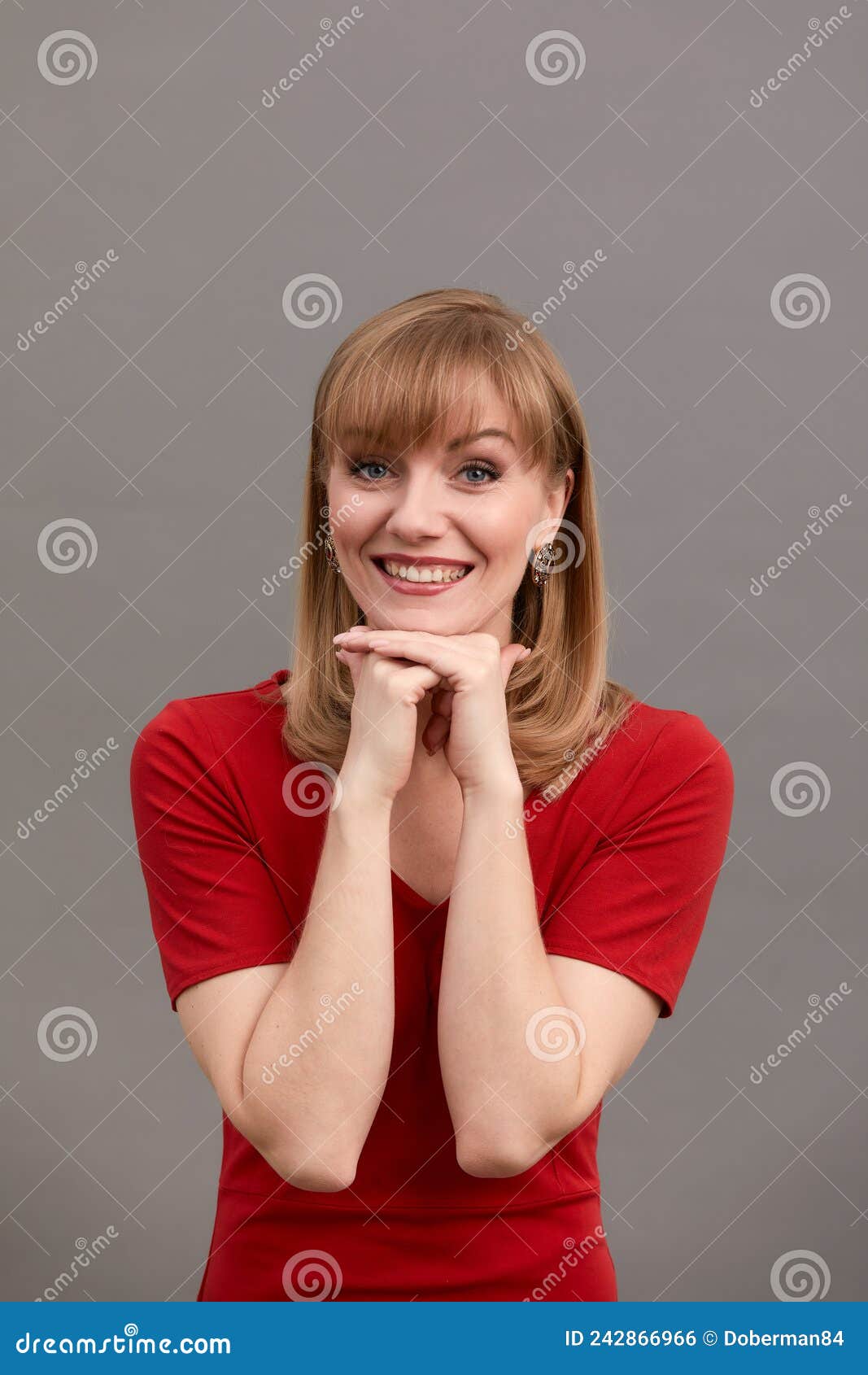 Happy Surprised Blonde Young Female Smiling Broadly At Camera And