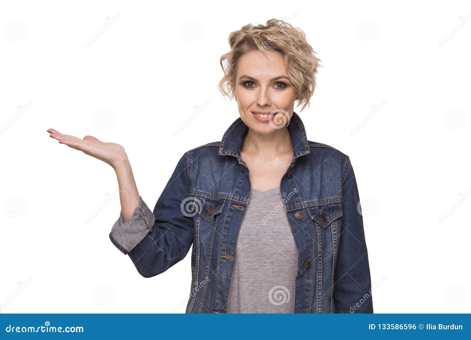 Happy Surprised Blonde Young Female Smiling Broadly At Camera Pointing