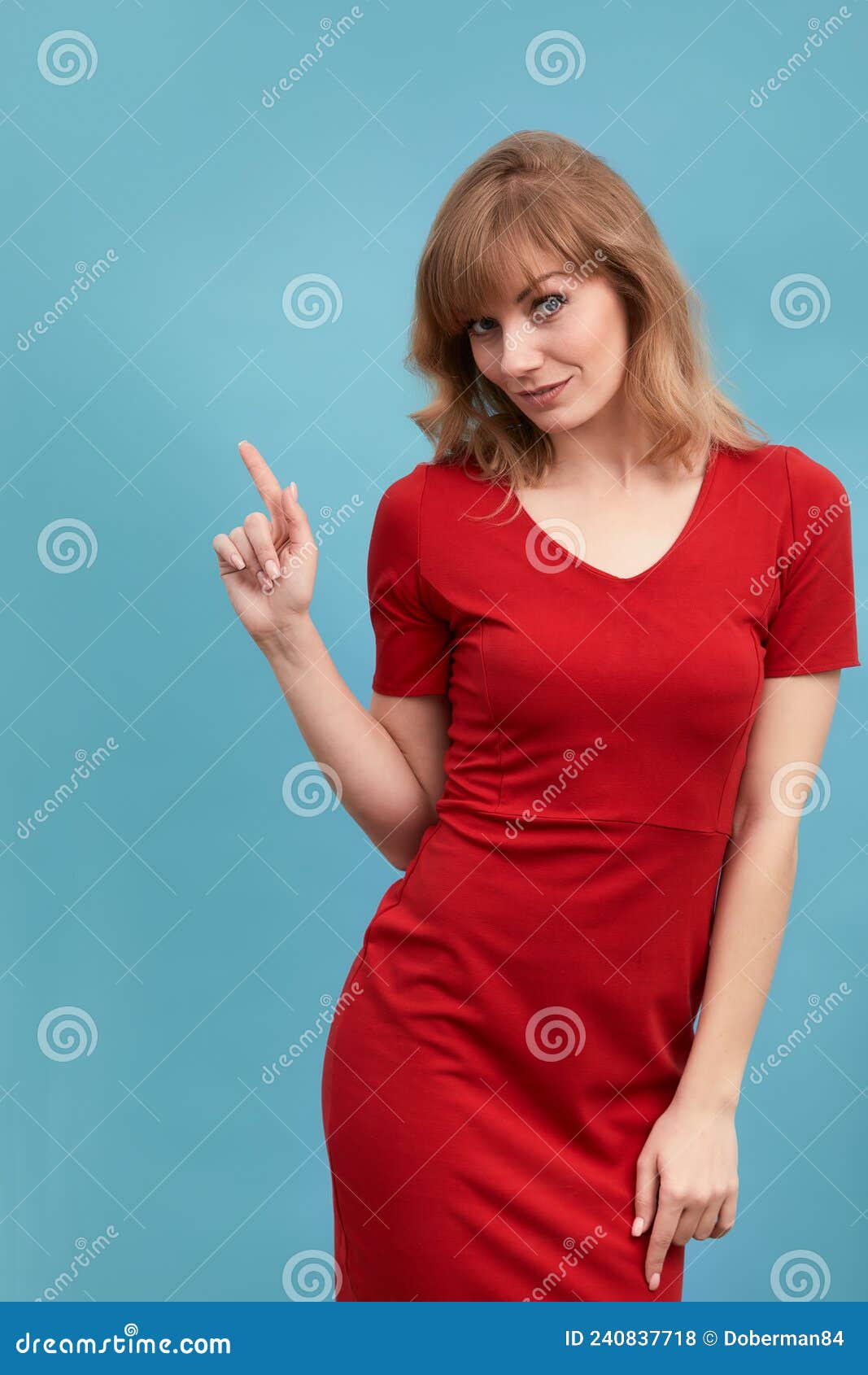Happy Surprised Blonde Young Female Smiling Broadly At Camera Pointing
