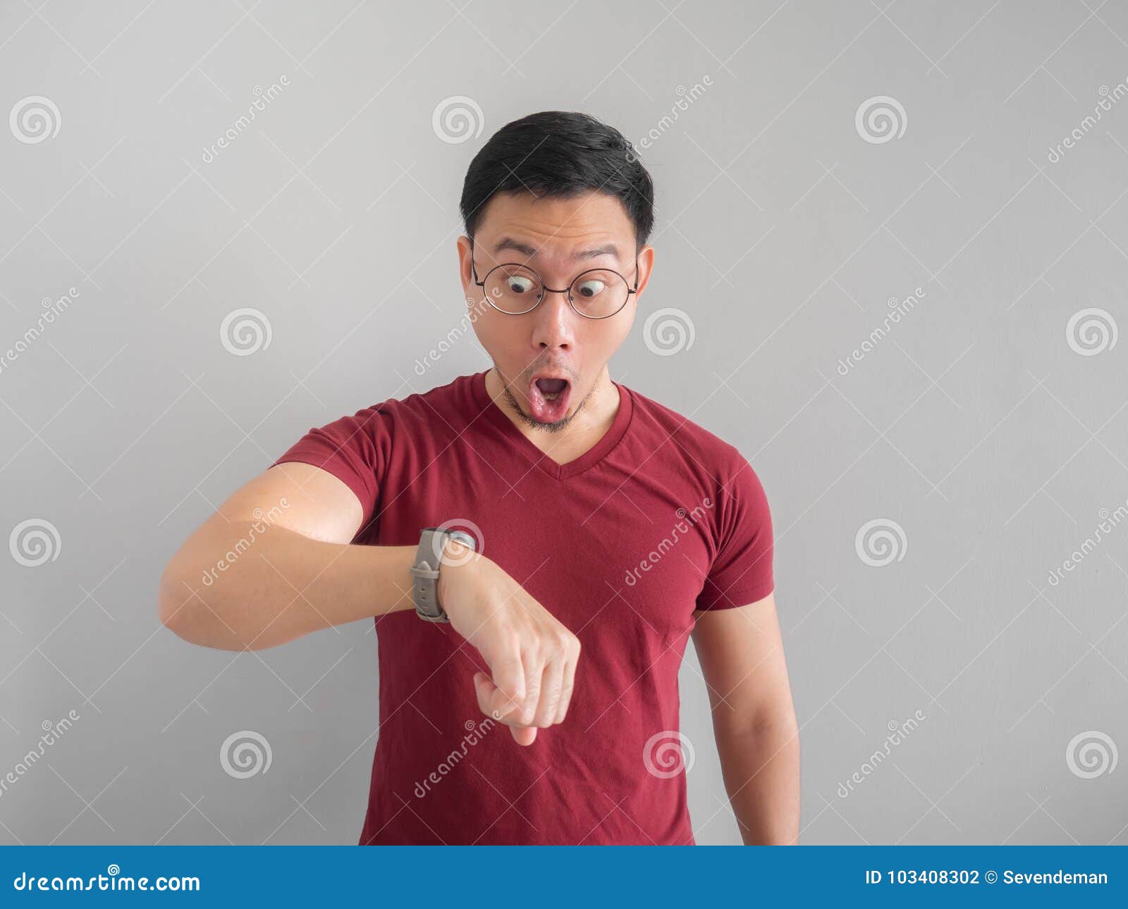 Happy and Surprised Man Who is Looking at His Watch. Stock Photo ...