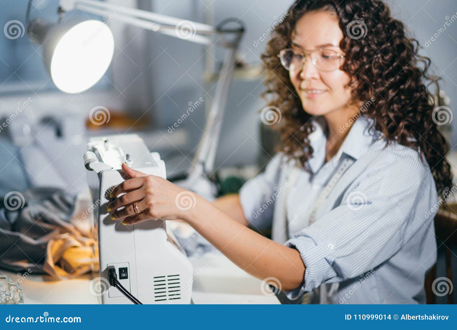 Happy Tailor Making Pattened Stitches on Sewing Machine in Studio Stock ...