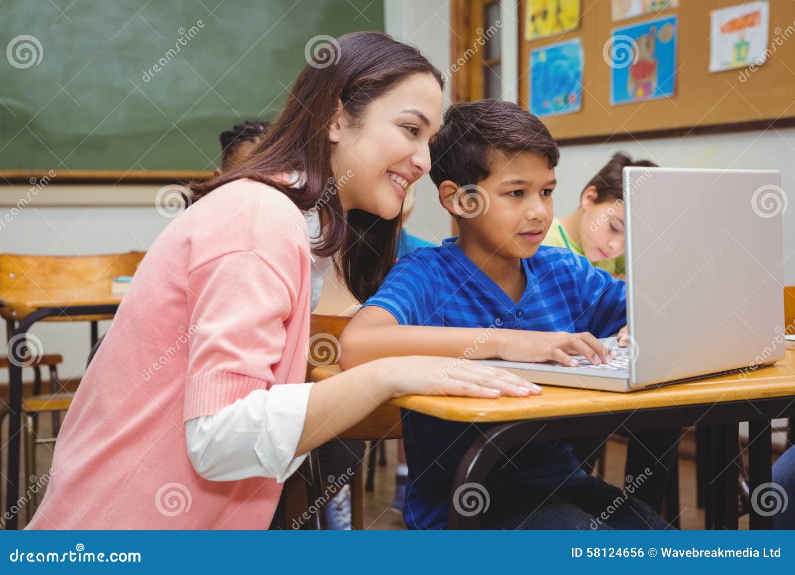Happy Teacher Using Laptop with Student Stock Photo - Image of female ...