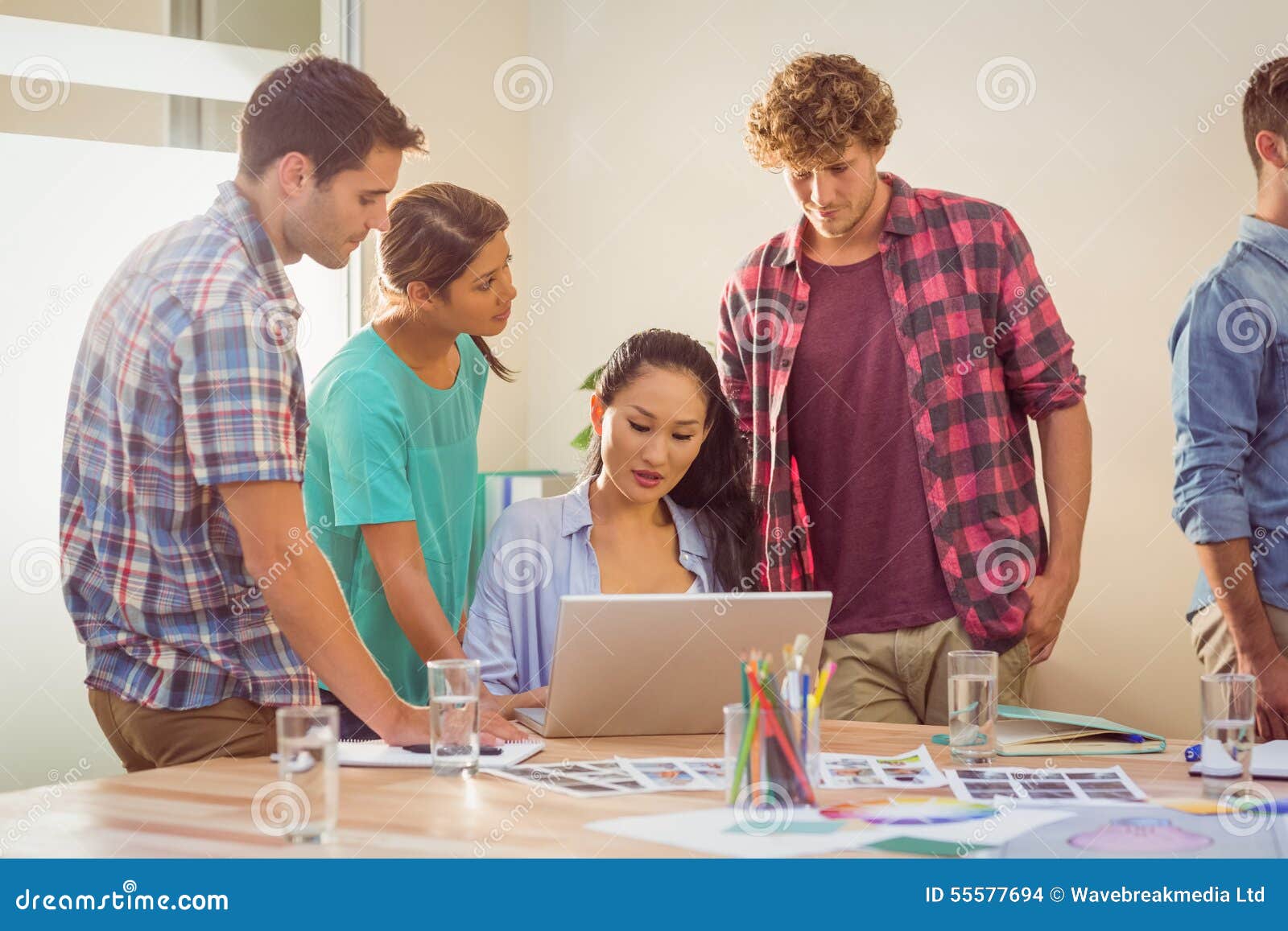 Happy Team Looking at Their Work Stock Photo - Image of casual ...