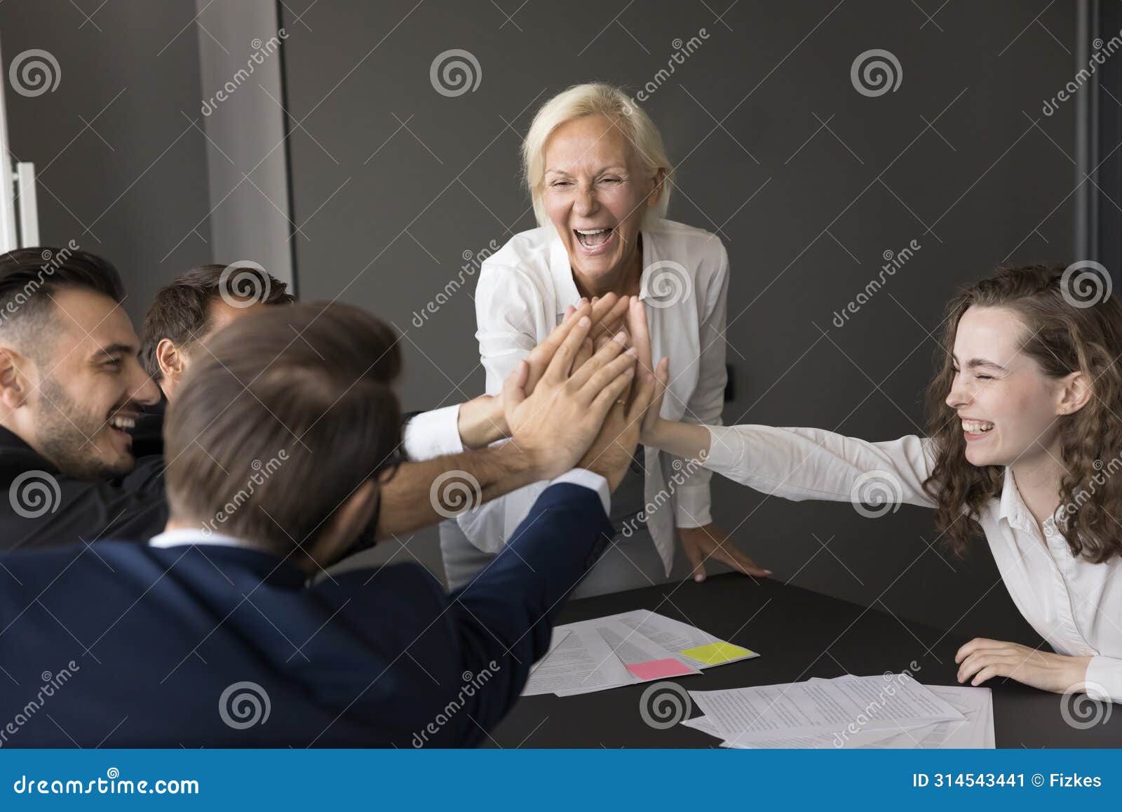 Happy Team Stack Their Hands Together, Showing Unity, Finish Teamwork ...