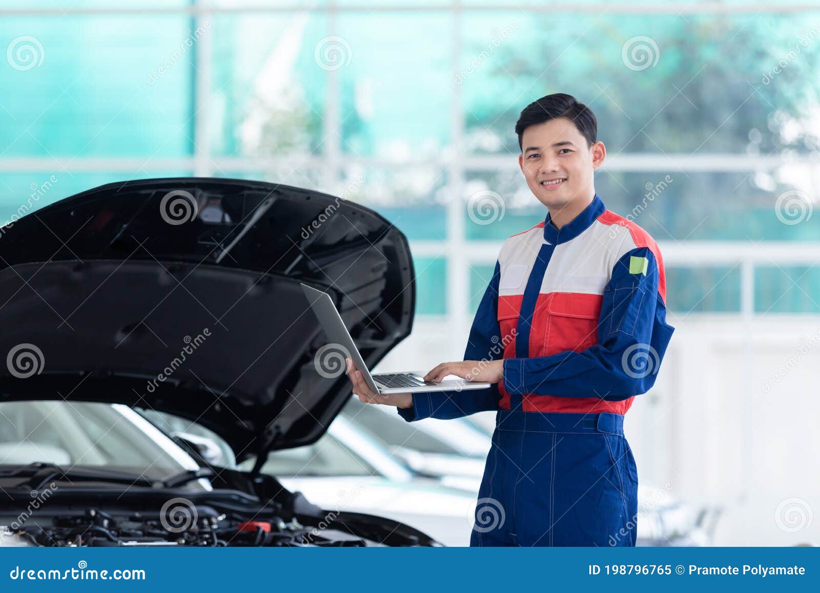 Happy Technician or Auto Mechanic Check Engine System New Car with a ...