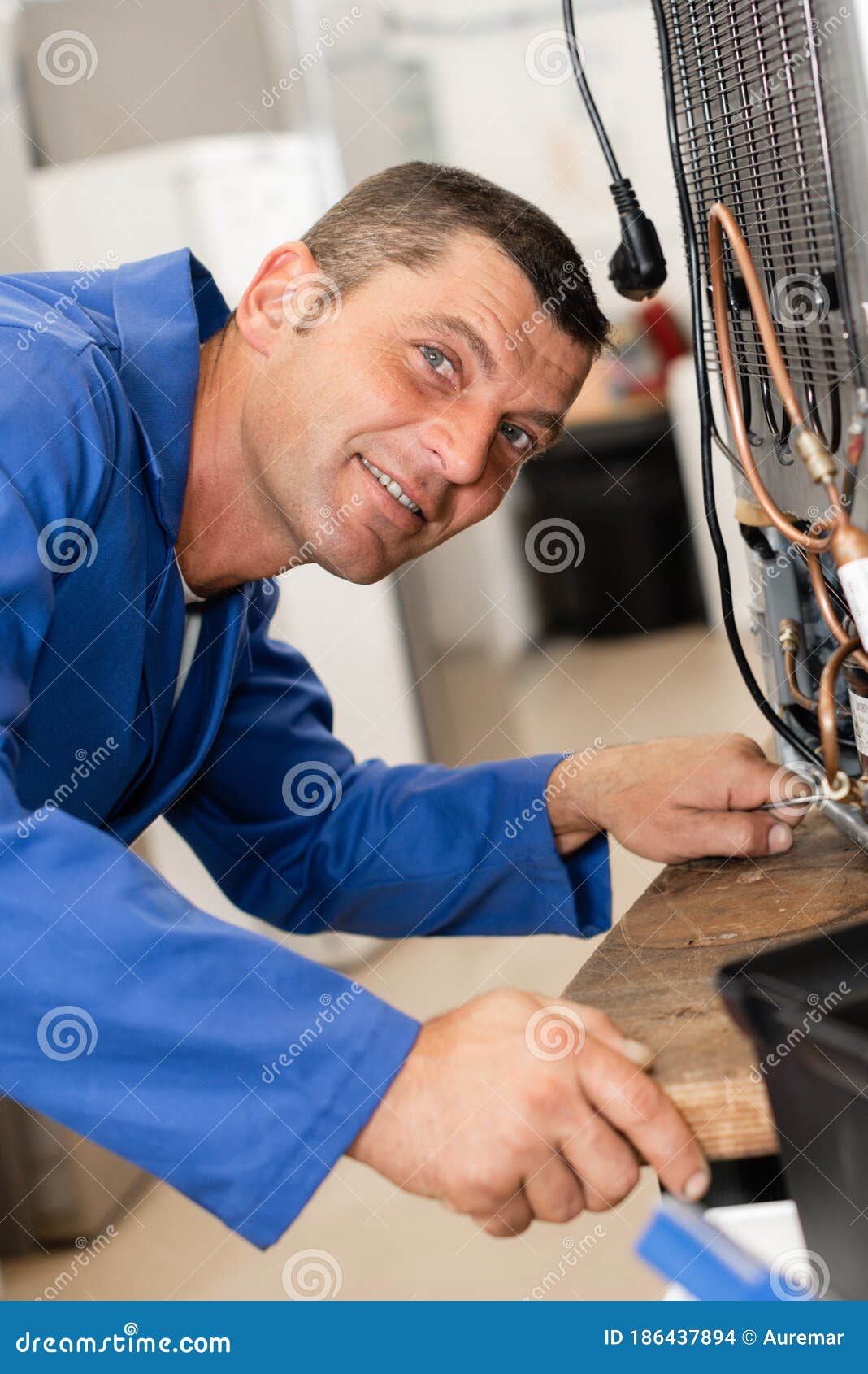 Happy Technician Smiling at Camera Stock Photo - Image of technician ...