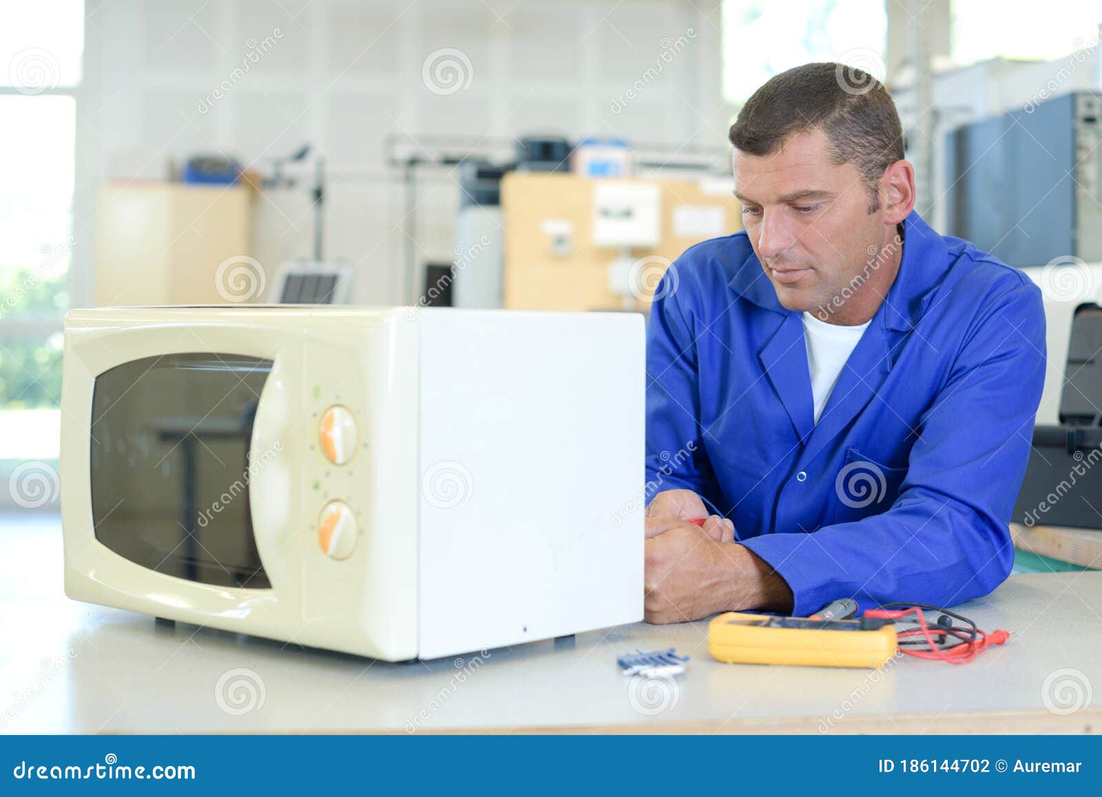 Happy technician at work stock photo. Image of program - 186144702