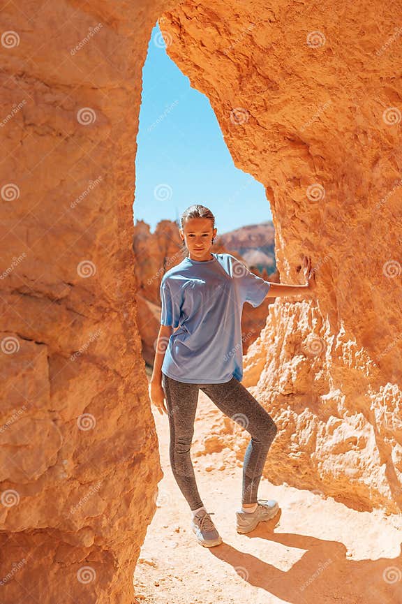 Hiker Girl In Bryce Canyon Hiking Relaxing Looking At Amazing View During Hike On Summer Travel