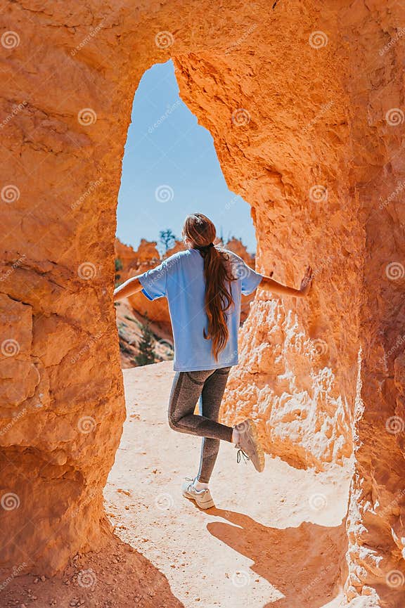 Hiker Girl In Bryce Canyon Hiking Relaxing Looking At Amazing View During Hike On Summer Travel