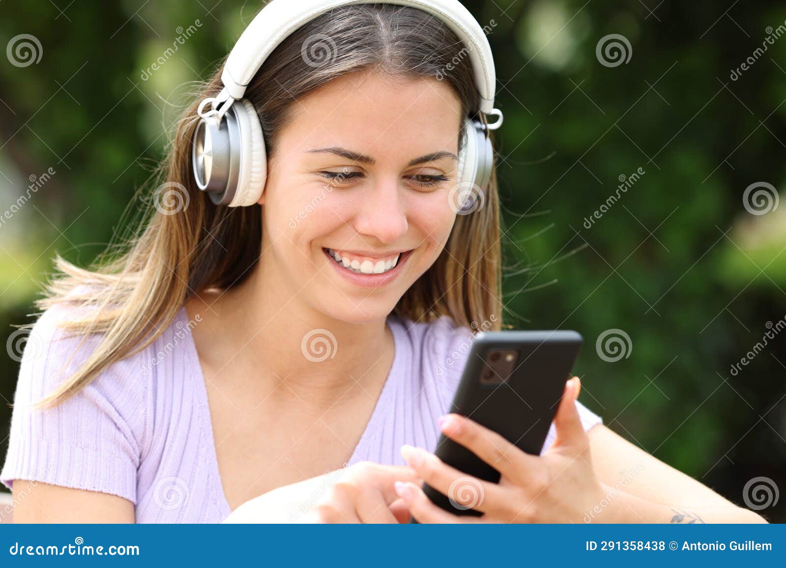 Happy Teen Using Cell Phone and Headphone Stock Photo - Image of ...
