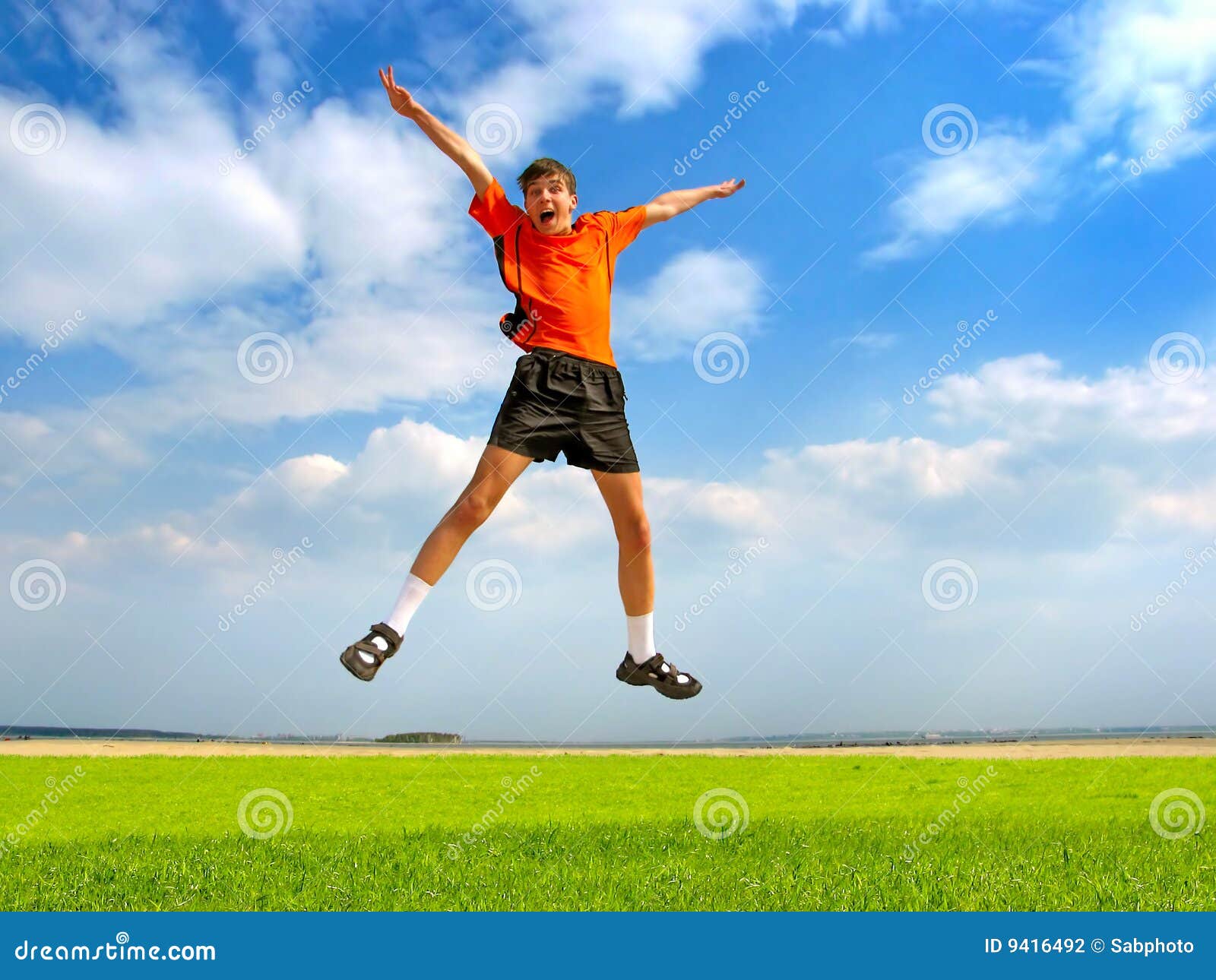 Happy teenager jumping stock photo. Image of arms, clear - 9416492