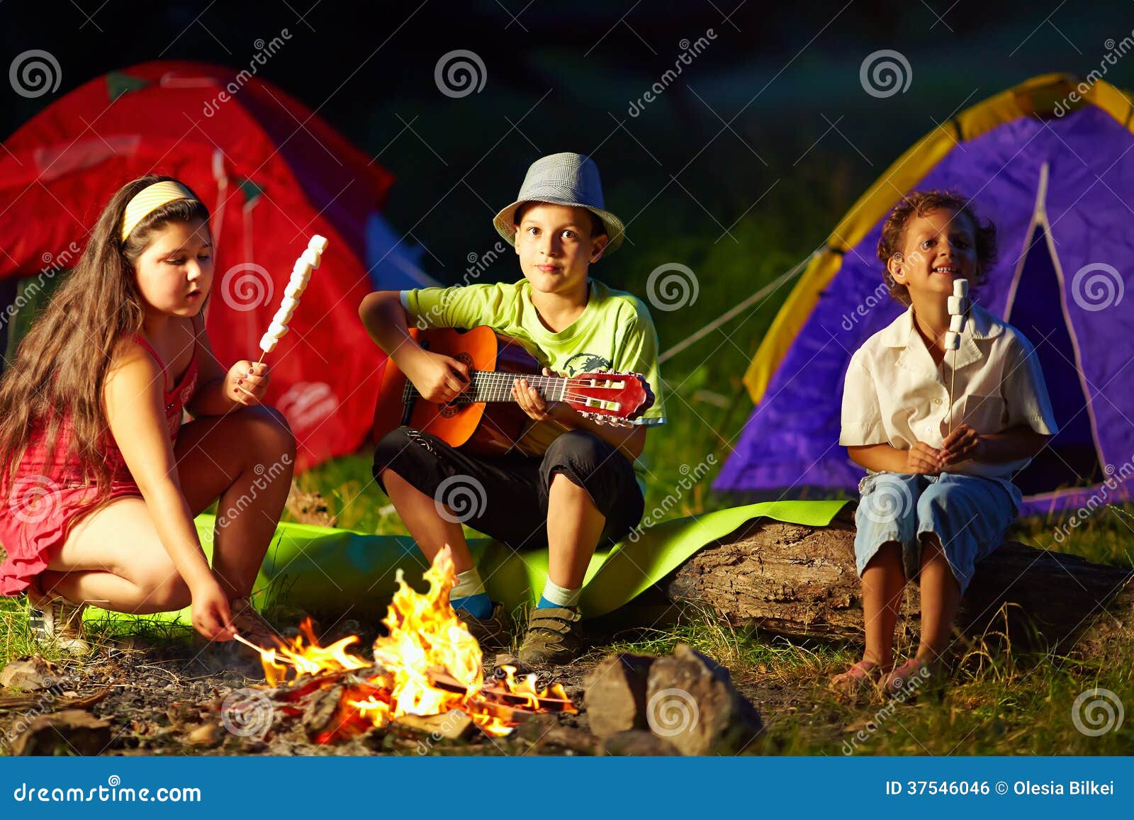 Happy Teens Around Night Campfire Stock Photo - Image of colorful, fire ...