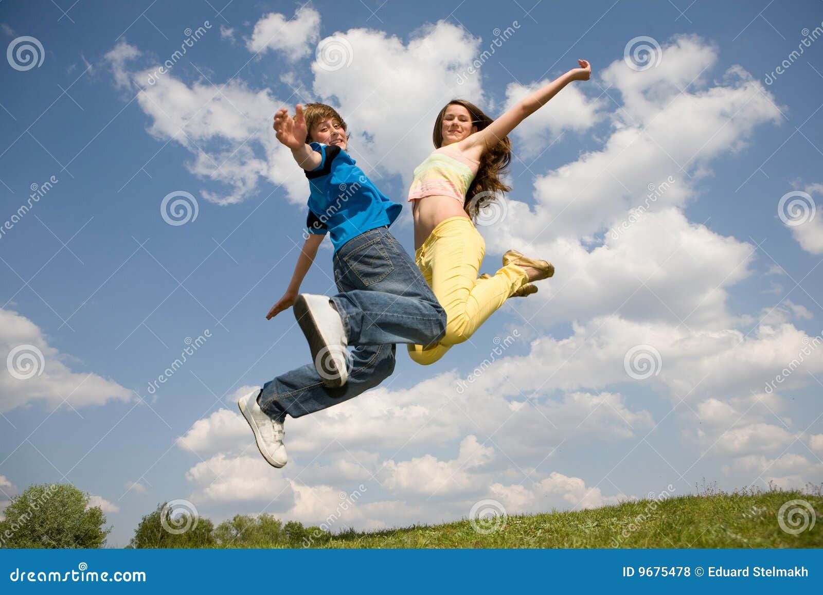 Happy Teens - Jumping Under Blue Sky. Soft Focus Stock Photo - Image of ...