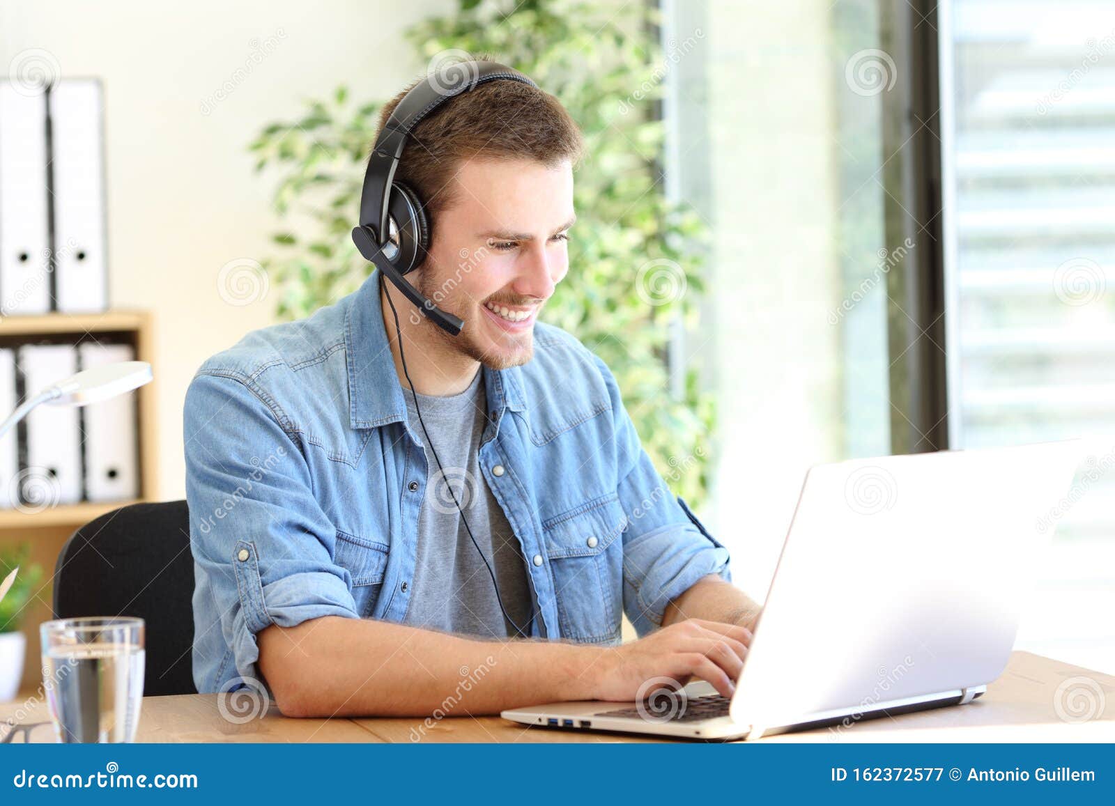 Happy Tele Operator Attending Call Working at Office Stock Image ...