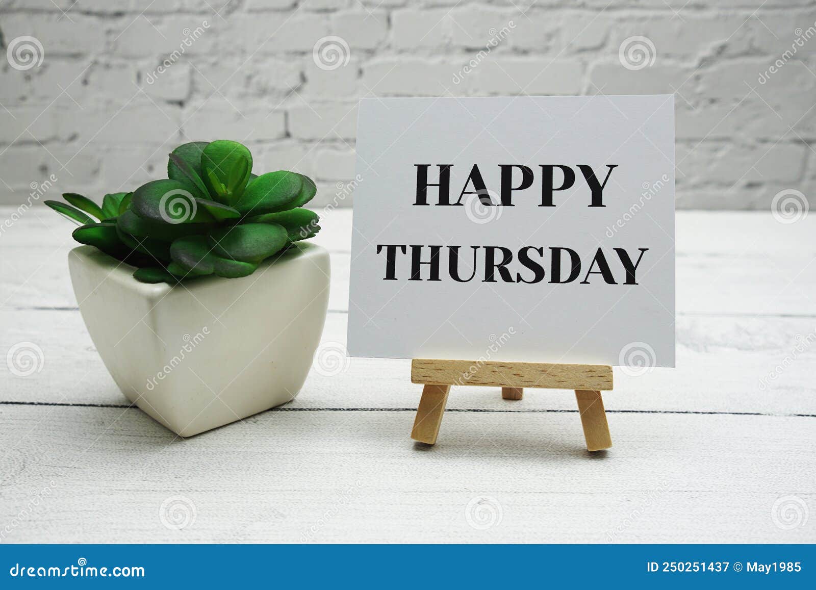 Happy Thursday Text on Wooden Easel Standing on White Brick Wall and ...