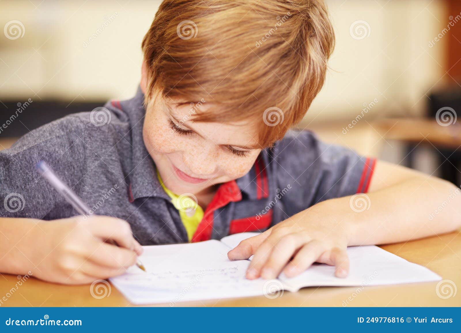 Happy To Do His Homework. a Cute Little Boy Doing His Homework in Class ...