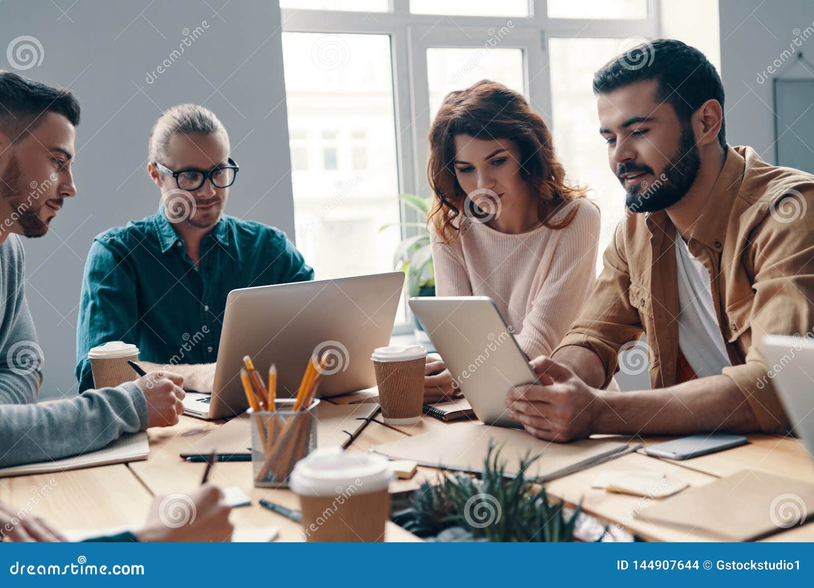 Happy to work together. stock photo. Image of adults - 144907644