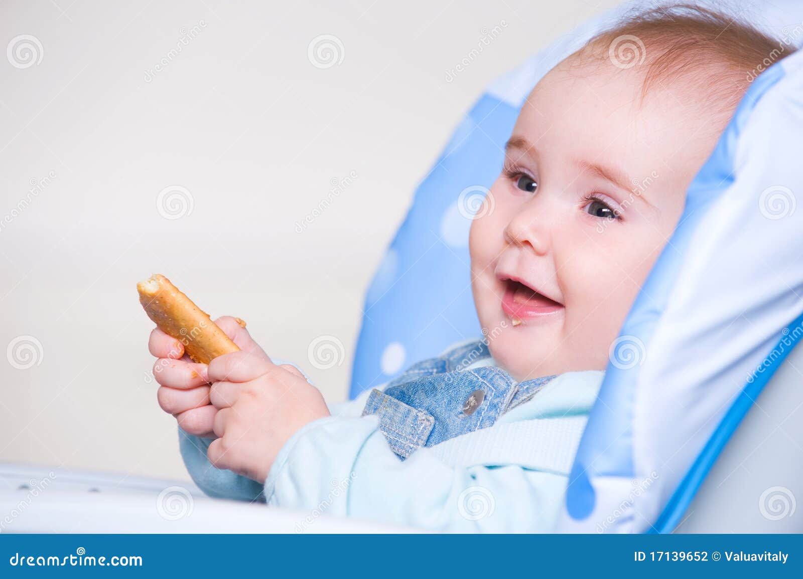 Happy Toddler Eating Cookie Stock Photo - Image of chair, eyes: 17139652