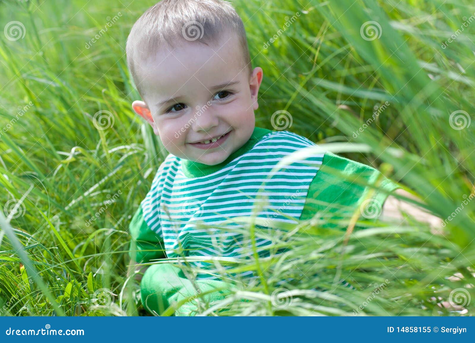 Happy toddler in the field stock image. Image of happiness - 14858155