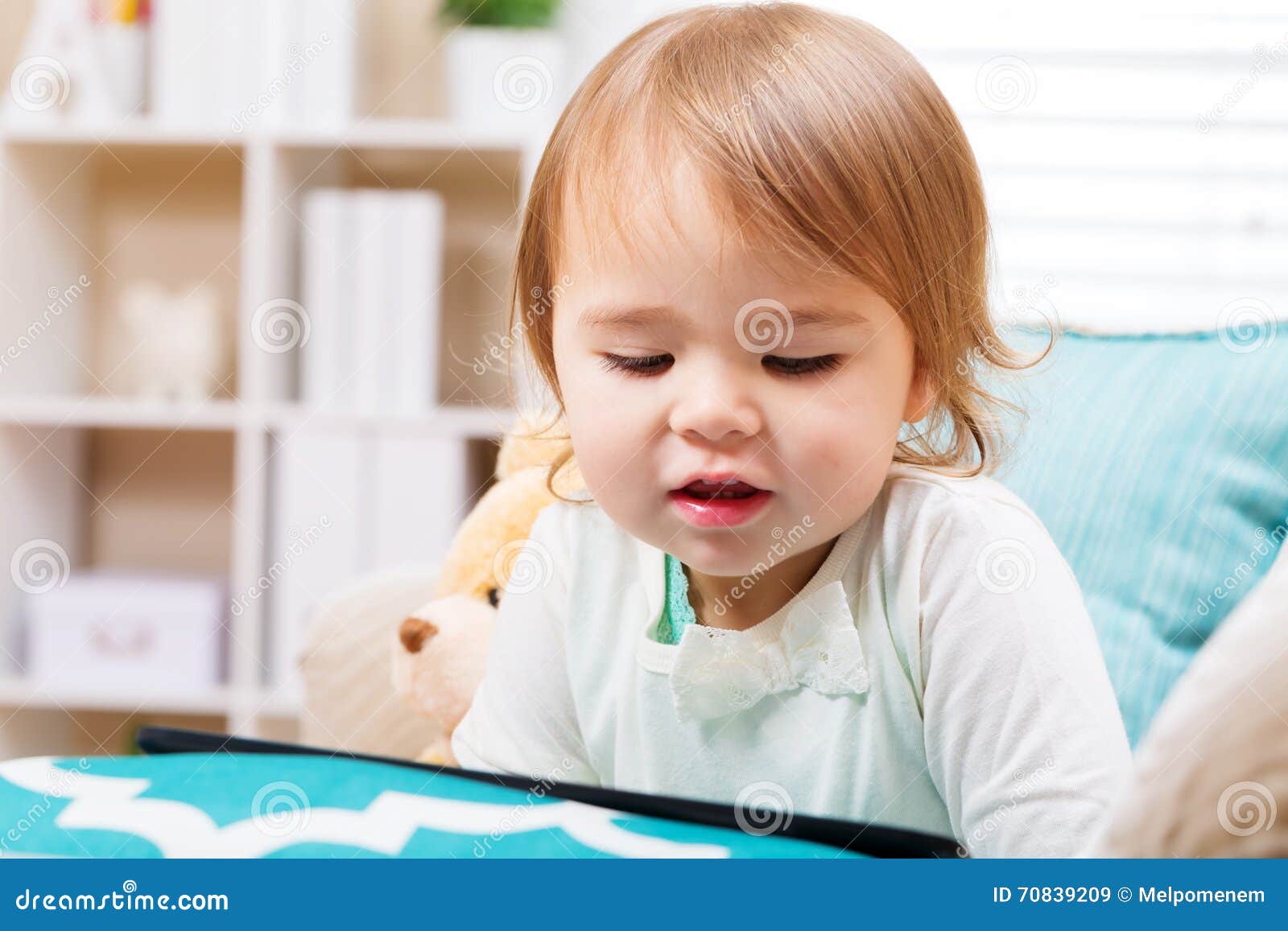 Happy Toddler Girl Watching Her Tablet Computer Stock Image - Image of ...