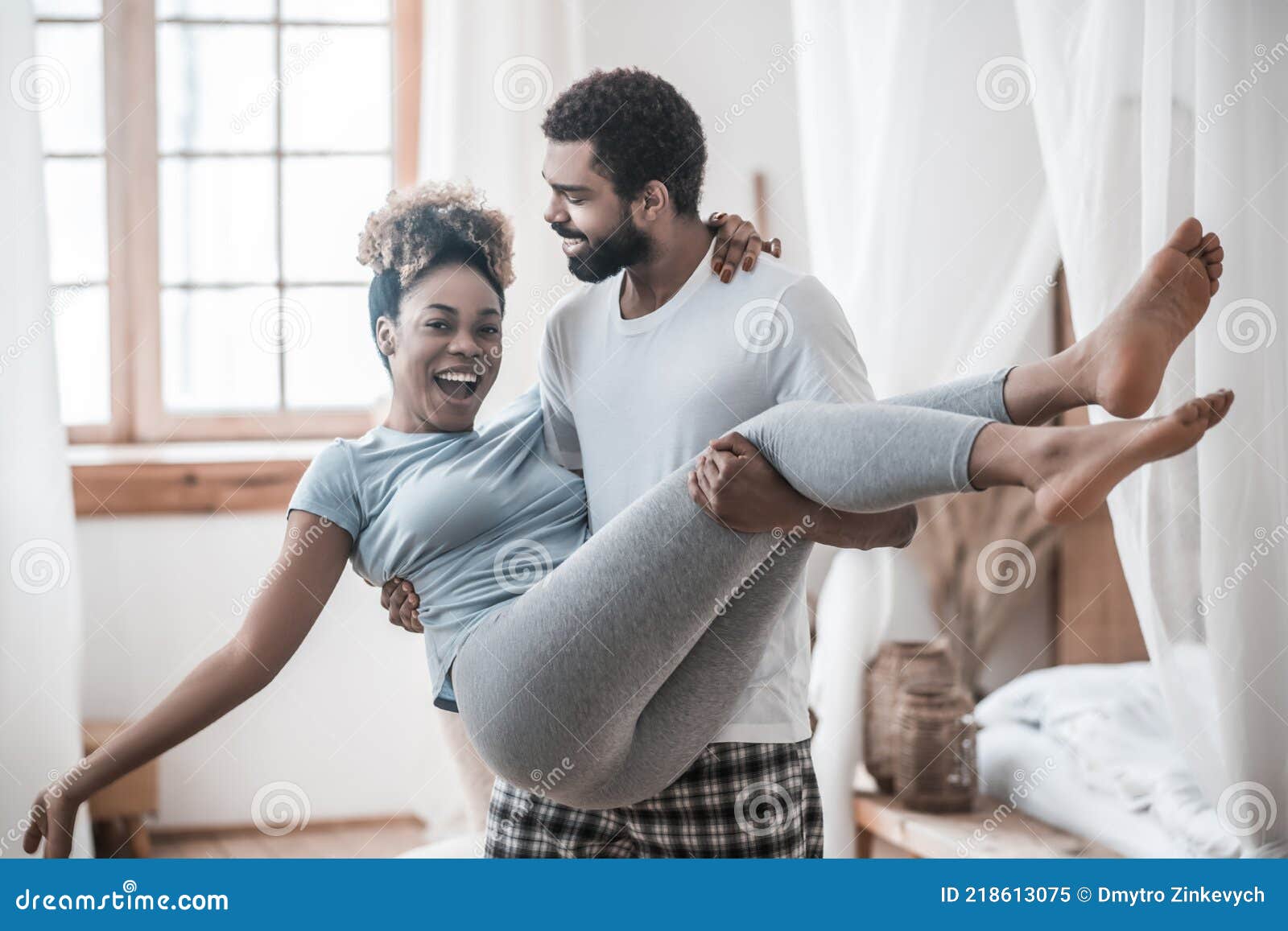 Caring Man Holding Joyful Woman In His Arms Stock Image Image Of
