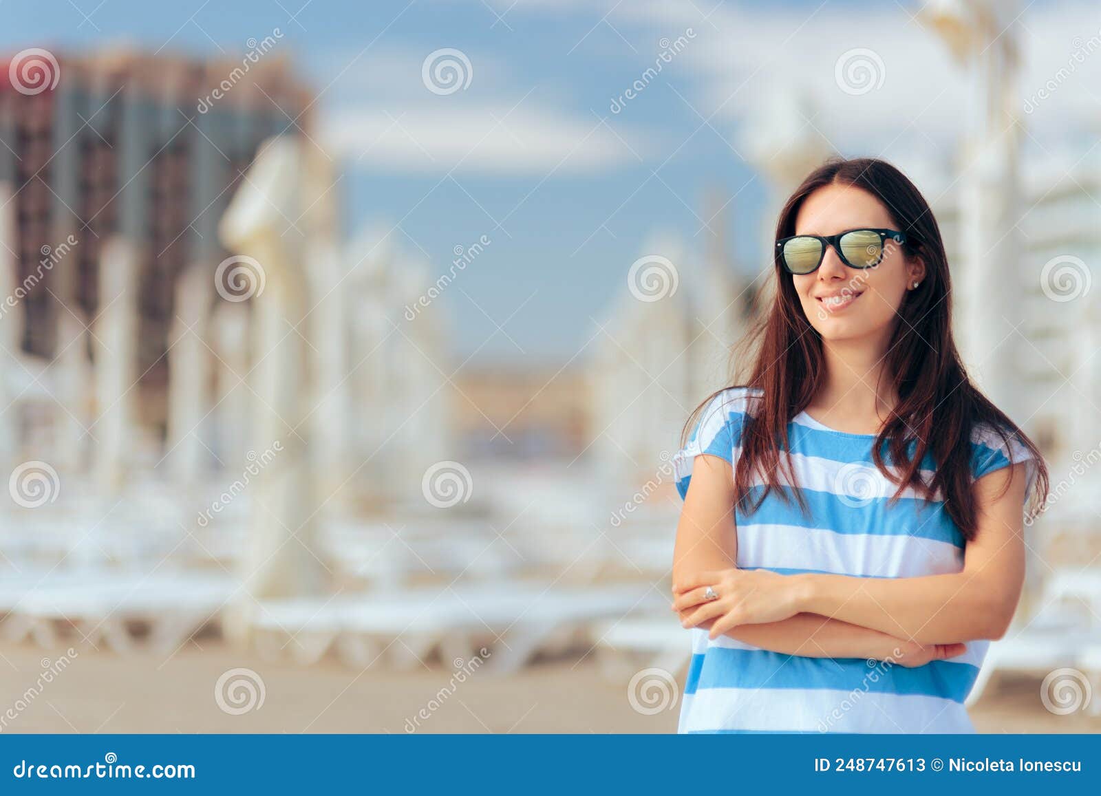 Happy Tourist Woman Wearing Sunglasses Smiling At The Beach Stock Image
