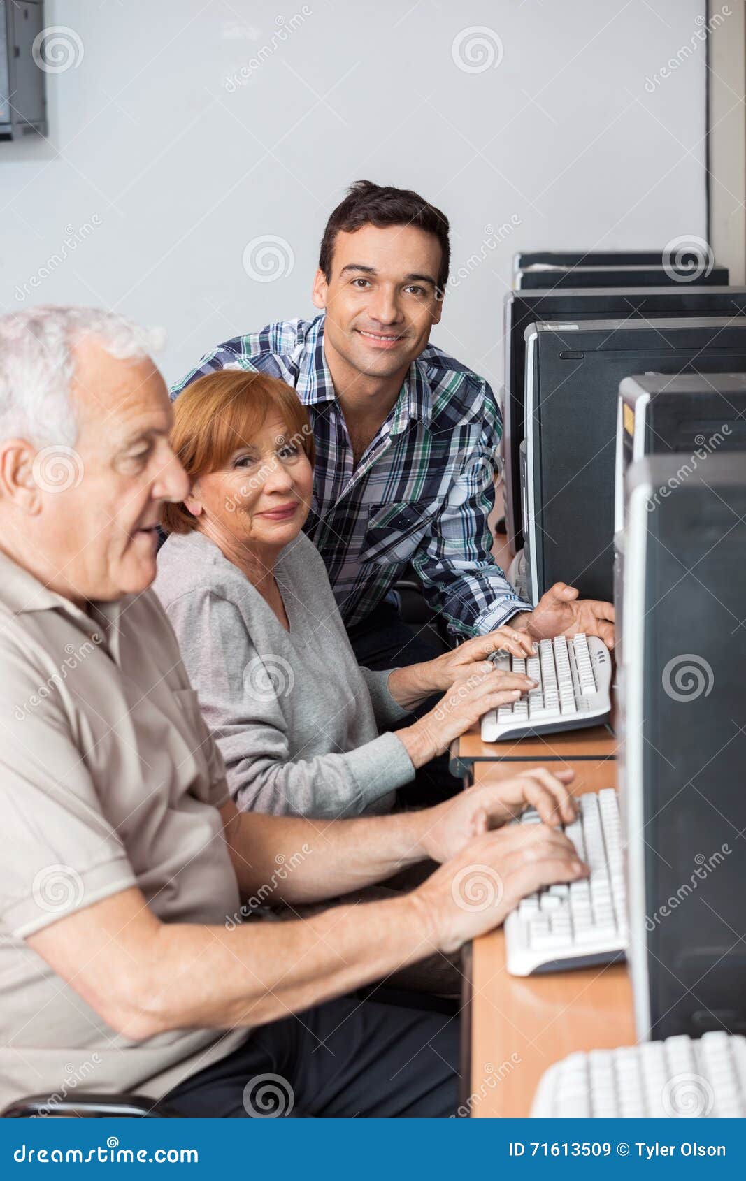 Happy Tutor with Senior Students in Computer Class Stock Image - Image ...