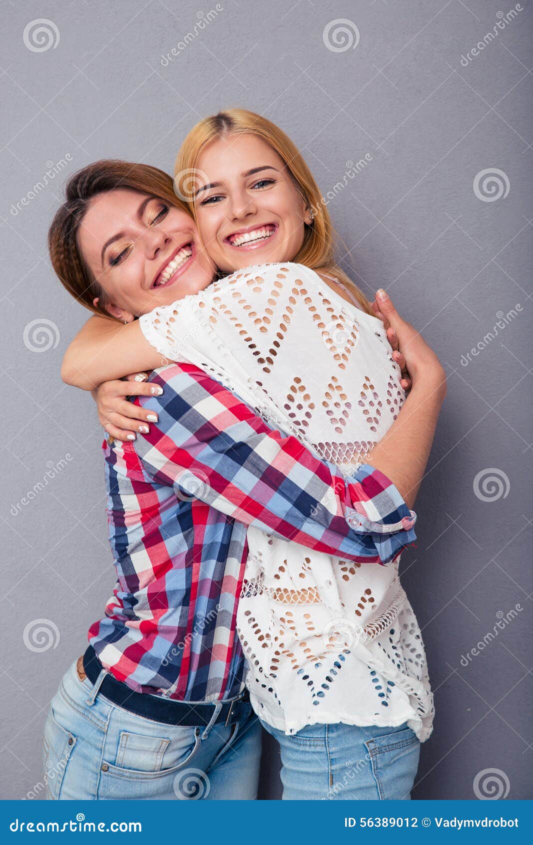 Happy two girls hugging stock photo. Image of women, hugging - 56389012