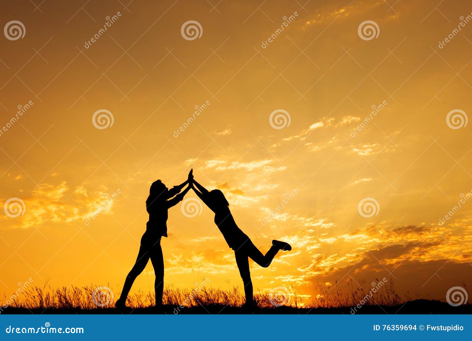 Happy of Two Women Clapping and Sunset Silhouette Stock Photo - Image ...