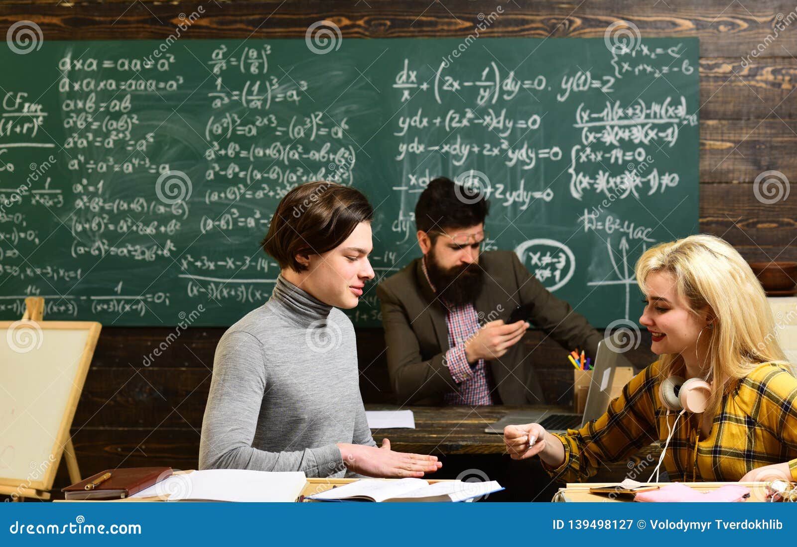 Happy University Students Studying with Books in Library. Student is ...