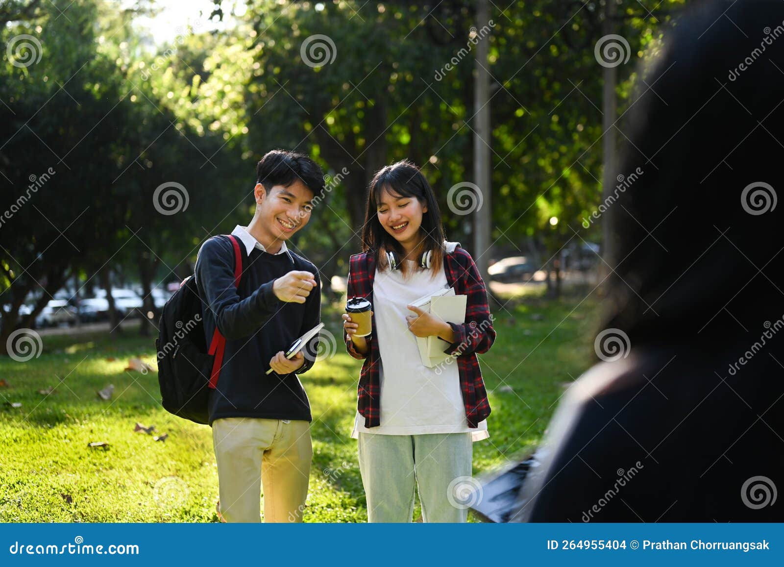 Happy University Students Talking about Lessons while Walking in ...
