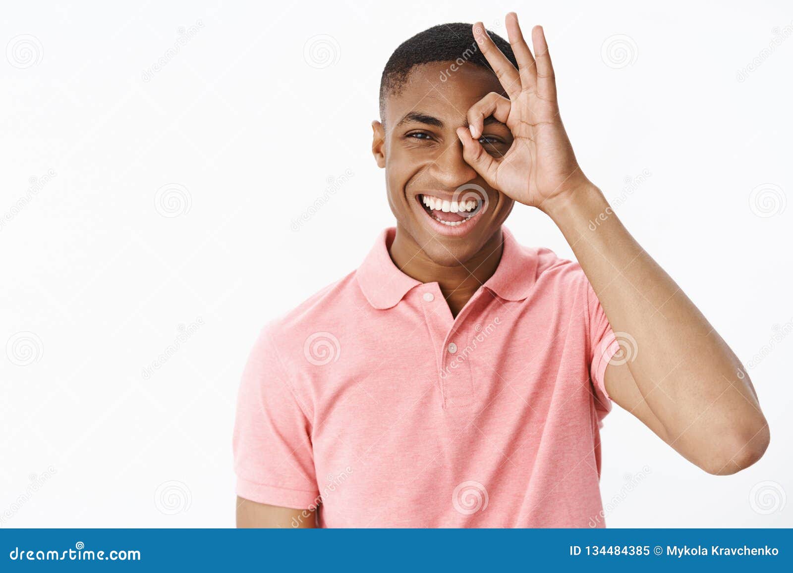 Happy Uplifted And Joyful Young Handsome African American Man In Pink