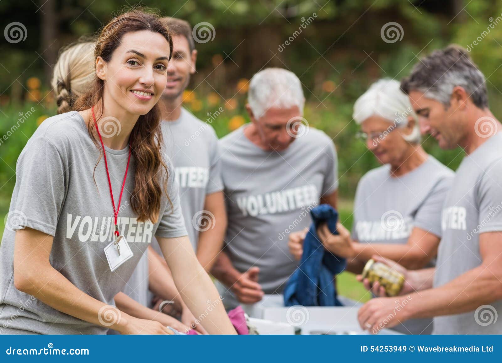 Happy Volunteer Looking at Donation Box Stock Image - Image of happy ...