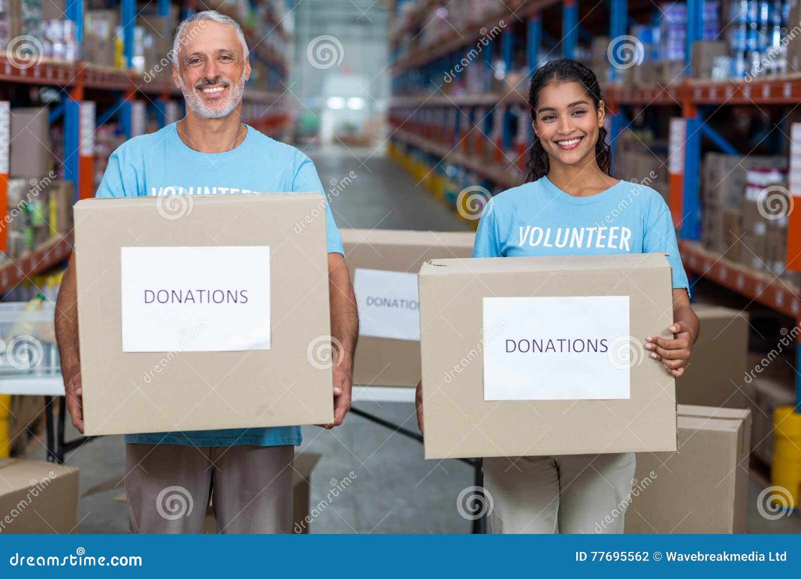 Happy Volunteers are Smiling and Holding Donations Boxes Stock Photo ...