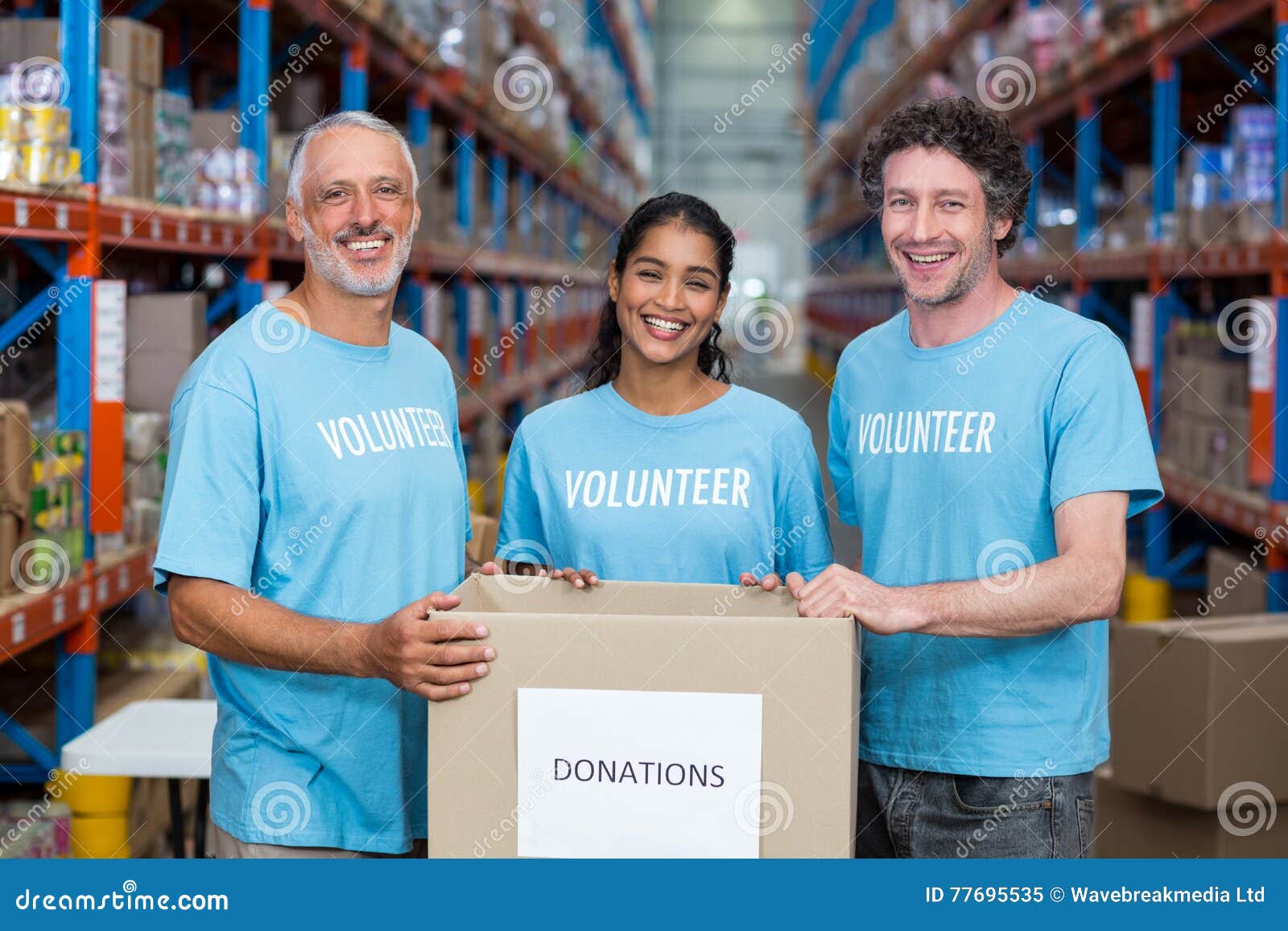 Happy Volunteers are Smiling and Posing with a Donations Box Stock ...