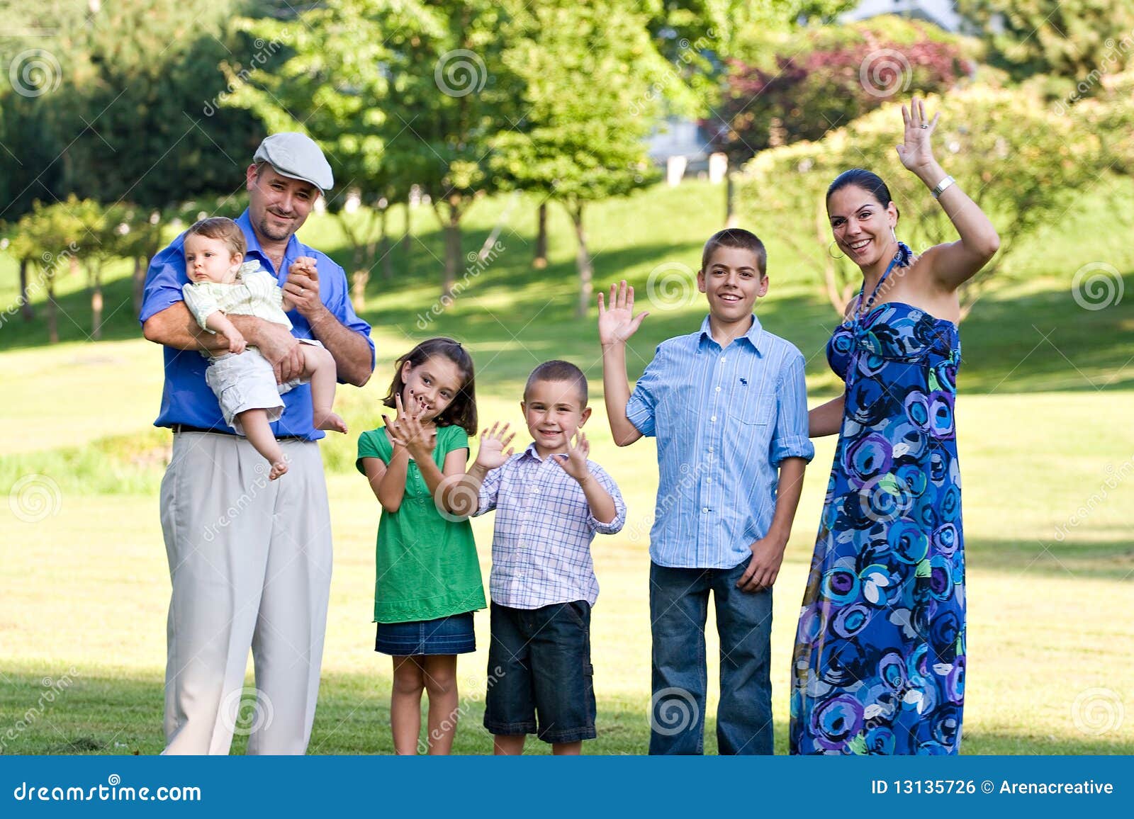 Happy Waving Family stock photo. Image of attractive - 13135726