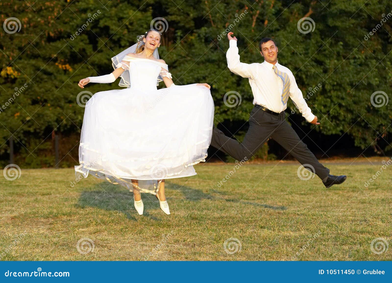 Happy Wedding Couple Jump Stock Photos - Royalty Free Pictures