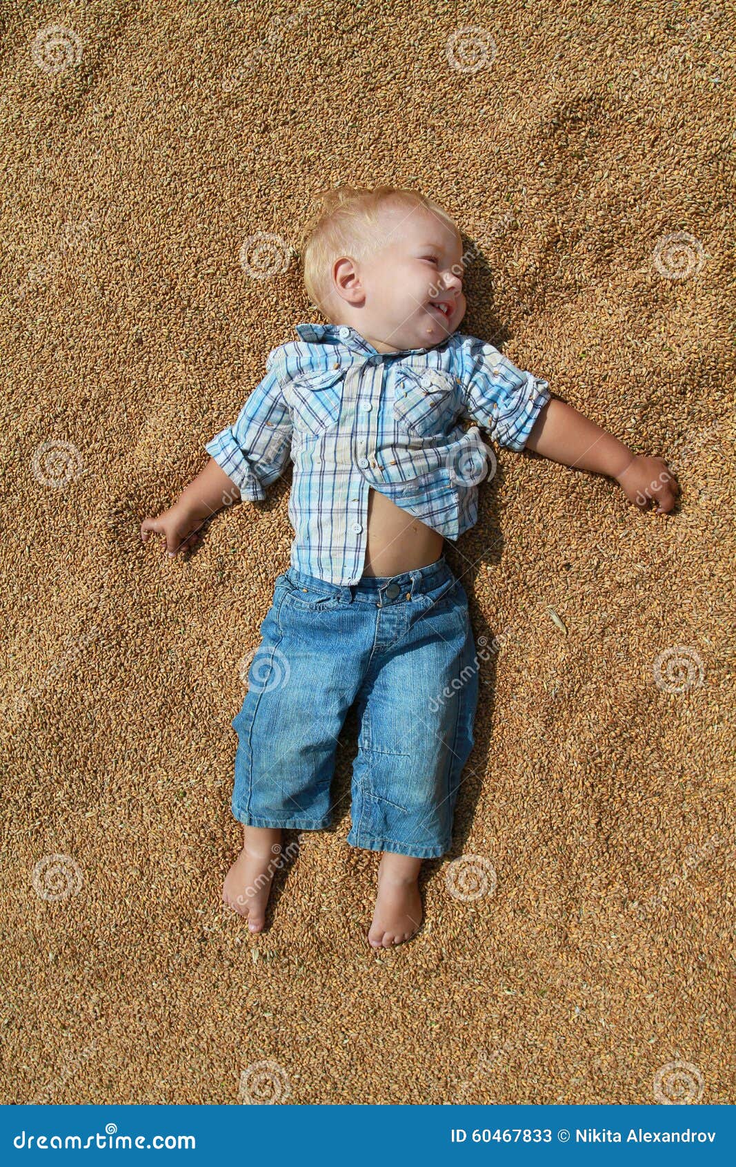 Happy White Baby Lying Outstretched Hands on the Grain Stock Image ...