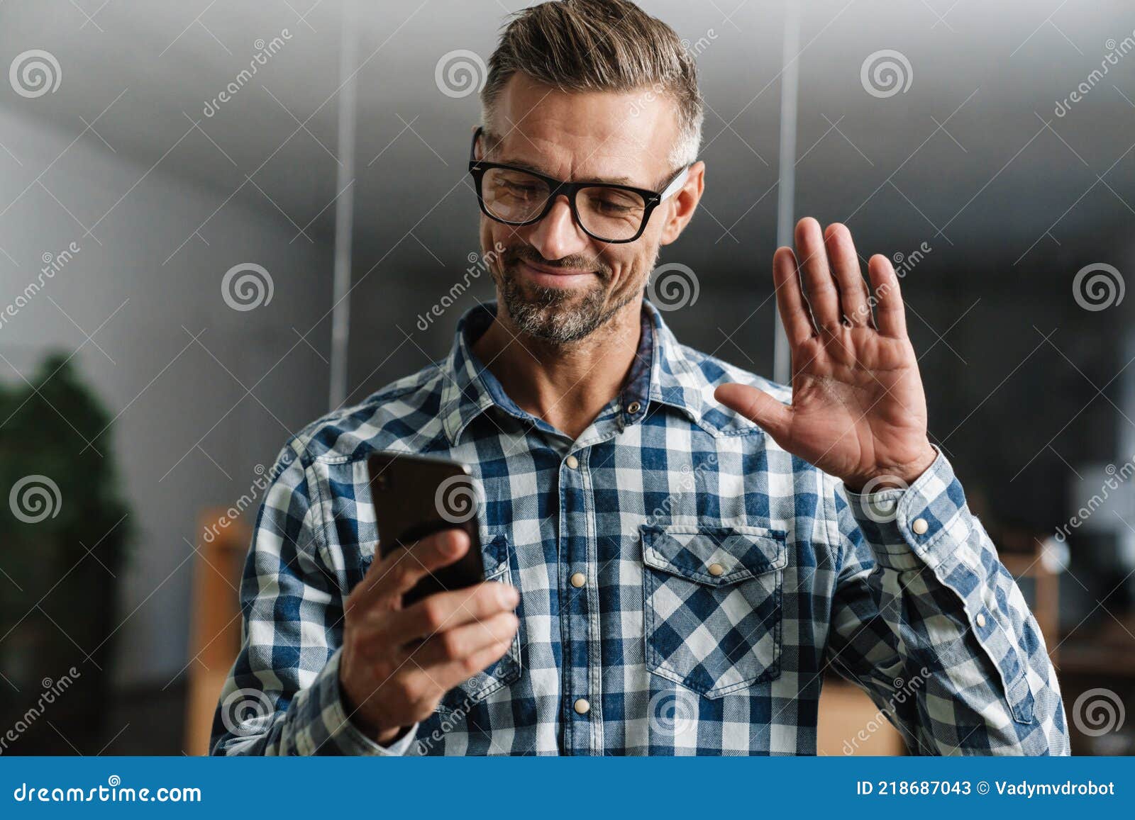 Happy White-haired Man Waving Hand while Using Mobile Phone Stock Image ...