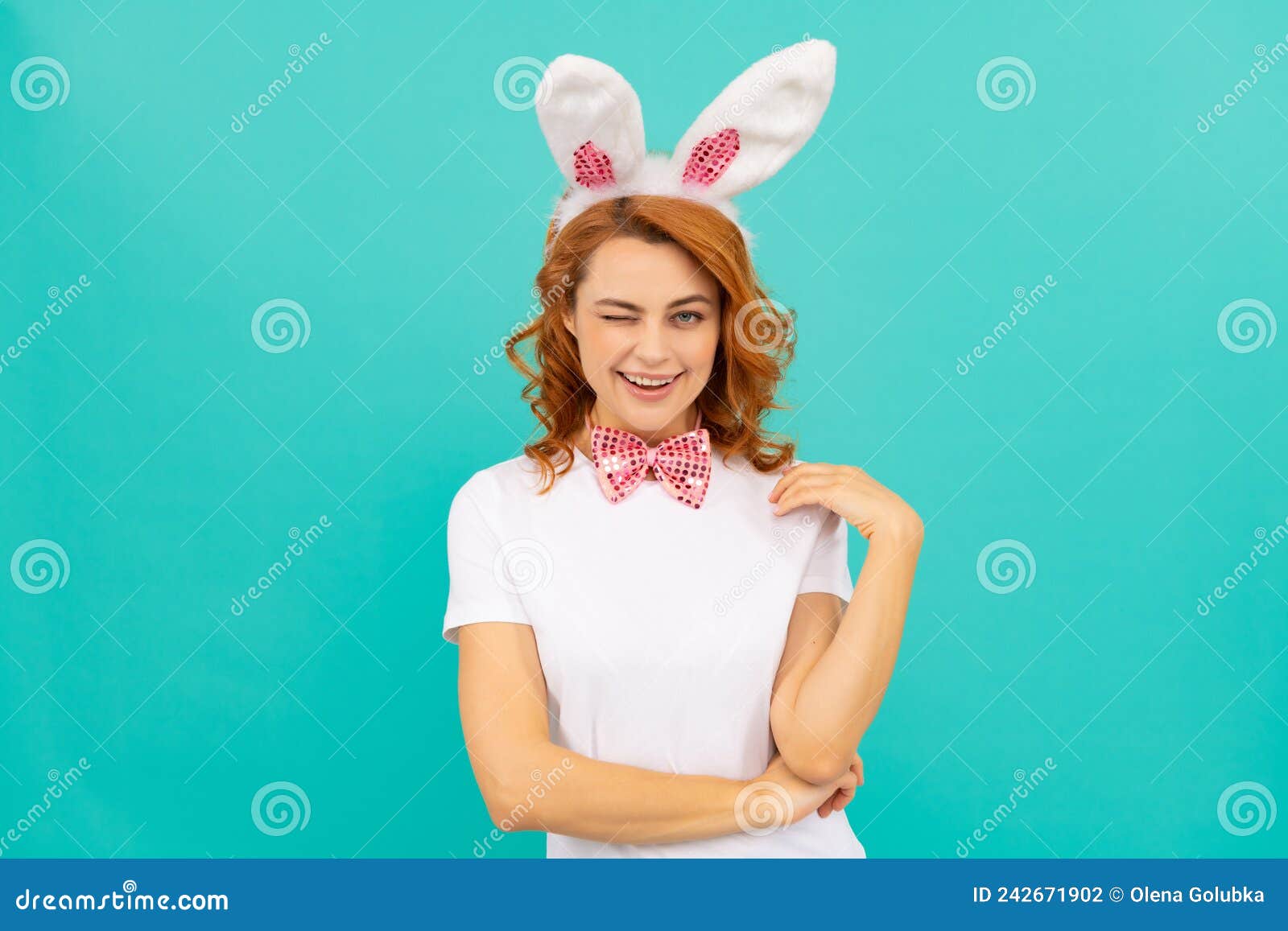 Happy Winking Easter Girl In Bunny Ears And Bow Tie On Blue Background
