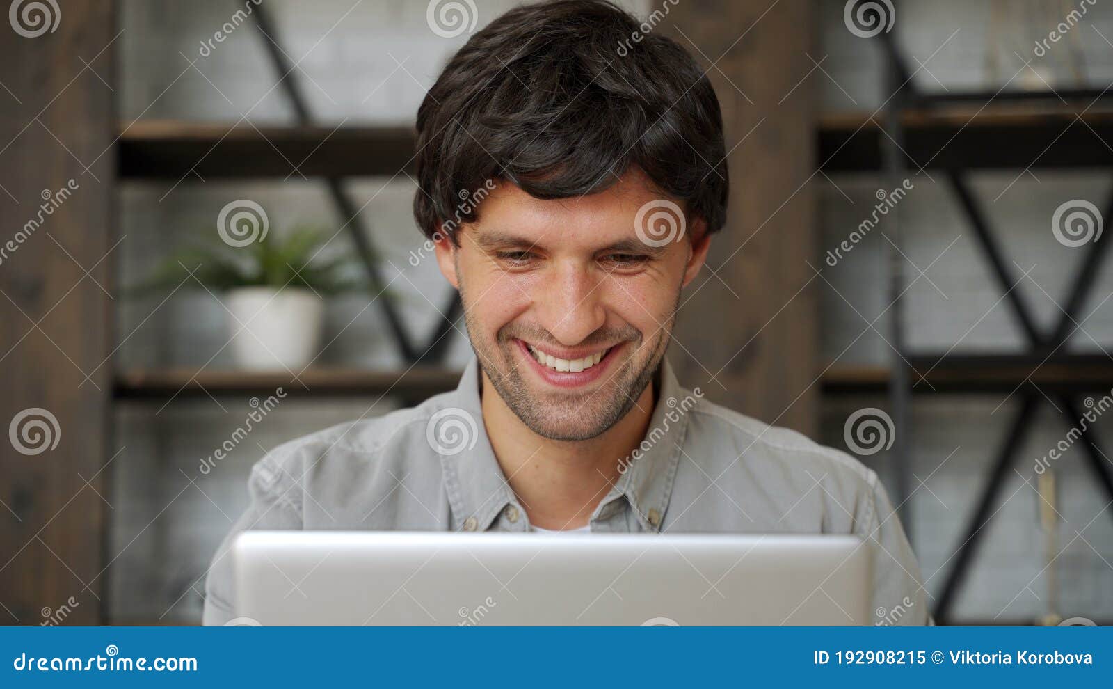 Happy Winner. Young Excited Man Using Laptop Computer while Sitting on ...