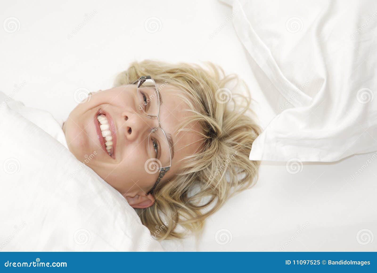Happy woman in bed stock image. Image of blond, female - 11097525