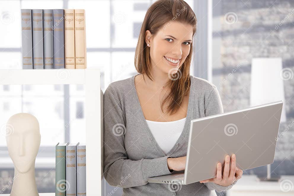 Happy Woman at Bookcase with Computer Stock Image - Image of american ...
