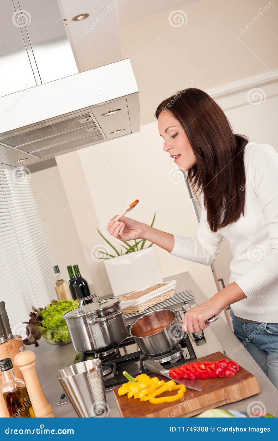 Happy Woman Cooking Tomato Sauce in the Kitchen Stock Photo - Image of ...