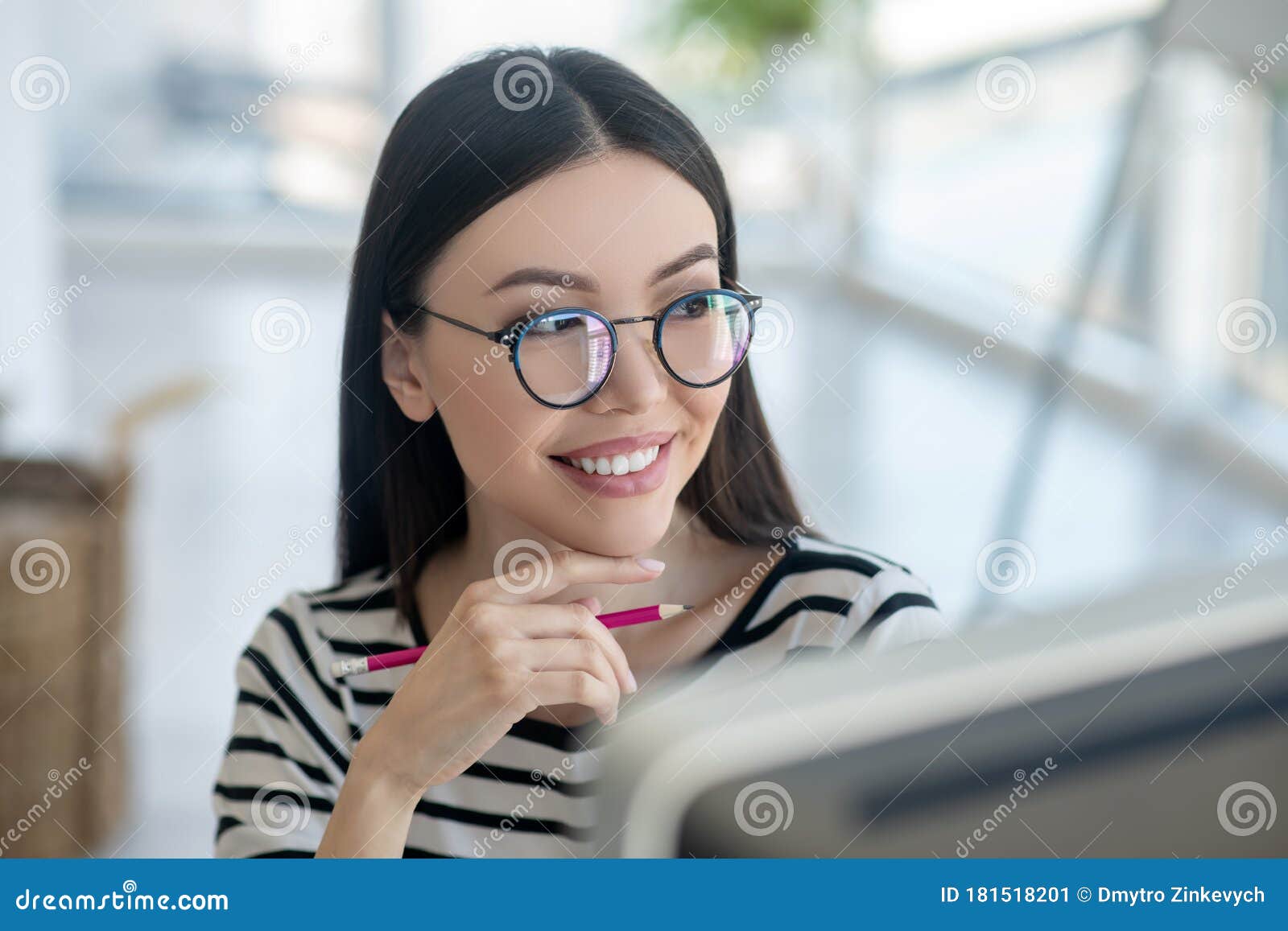 Dark Haired Pretty Woman In Eyeglasses Looking Happy Stock Image