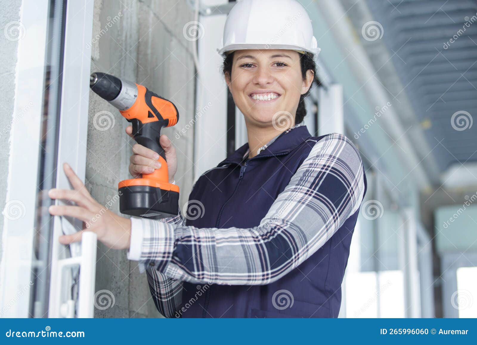Happy woman with drill stock photo. Image of drill, worker - 265996060