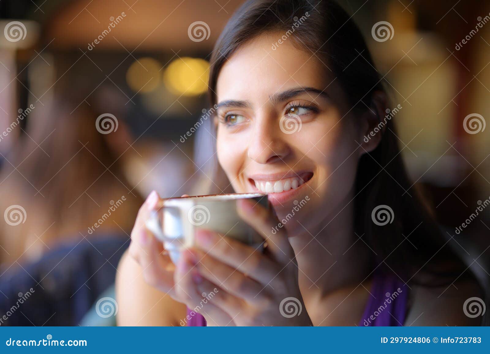 Happy Woman Drinking Coffee in a Restaurant Looking at Side Stock Photo ...