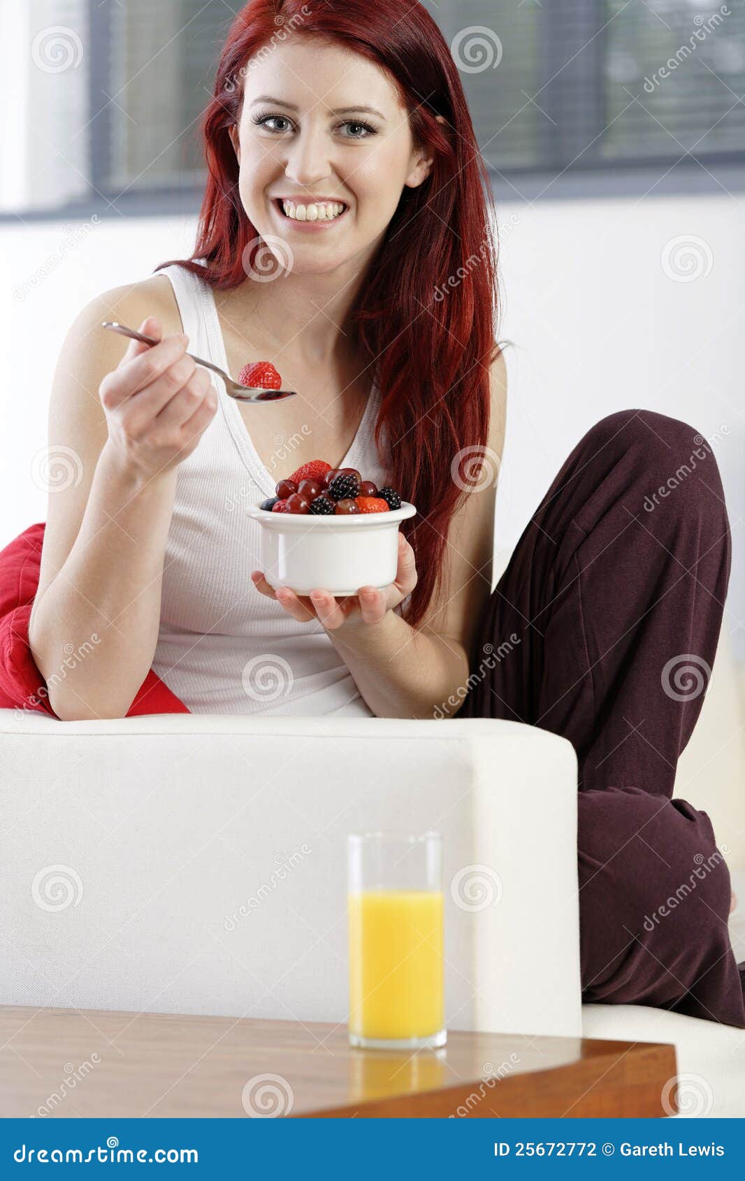 Happy Woman Eating Breakfast Stock Photo - Image of loung, beautiful ...