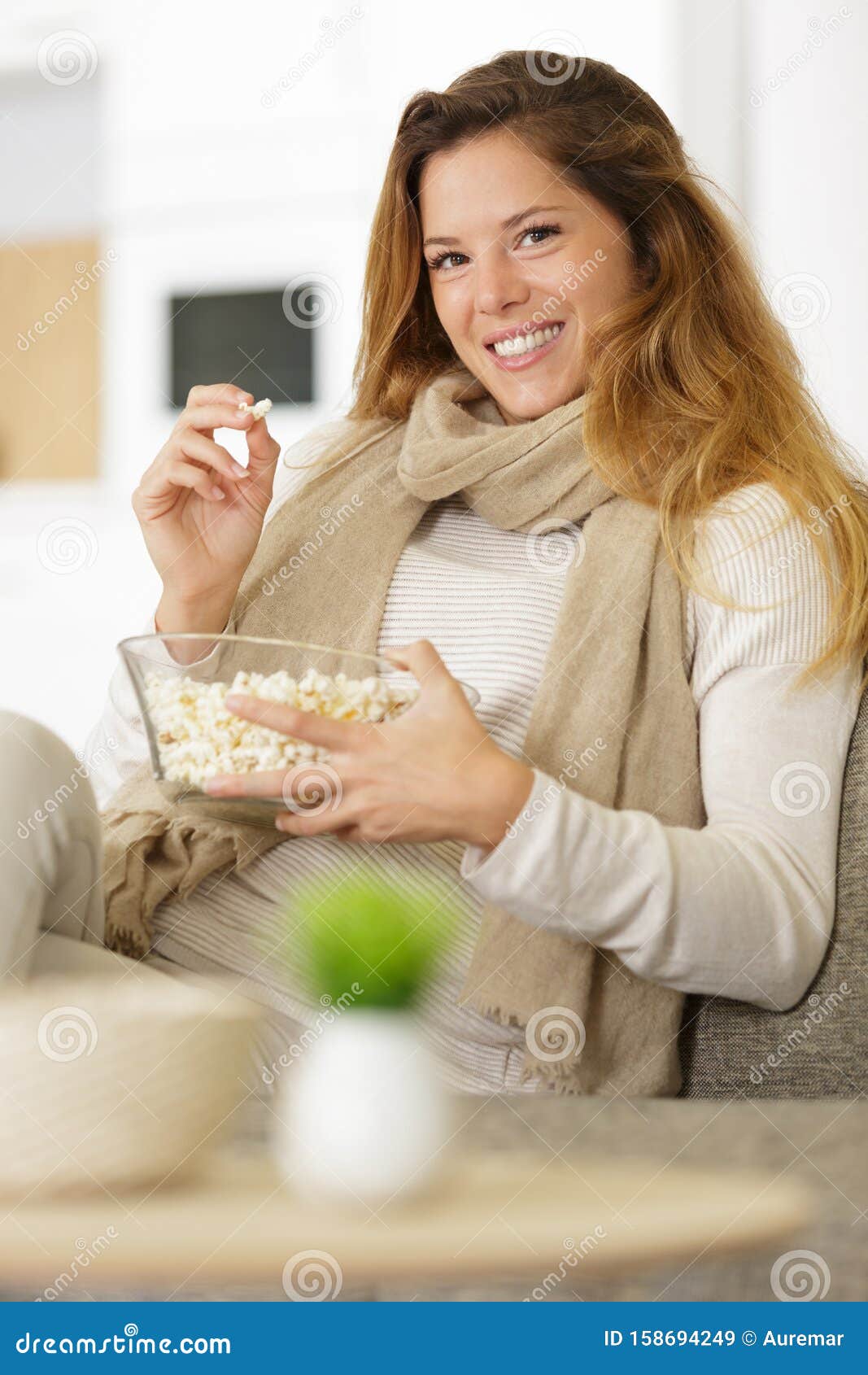 Happy woman eating popcorn stock image. Image of eating - 158694249