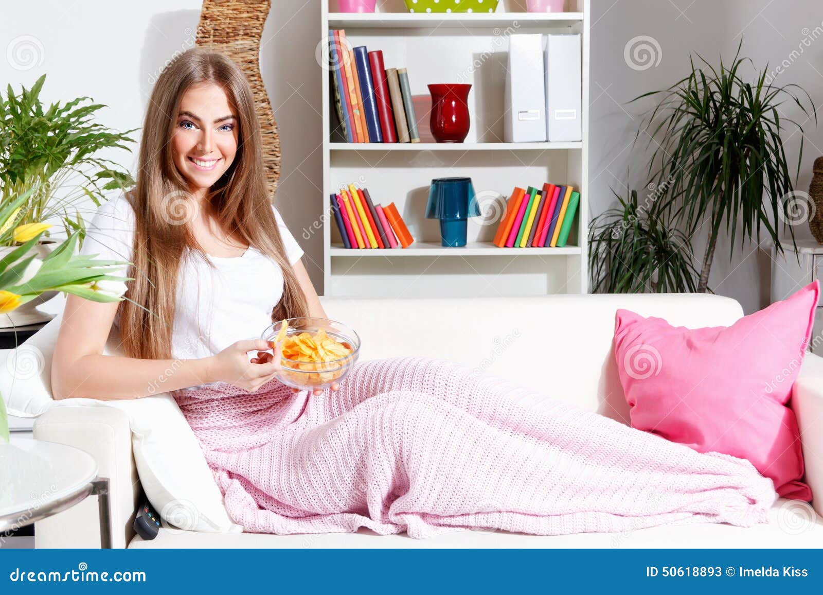 Happy woman eating snack stock image. Image of interior - 50618893